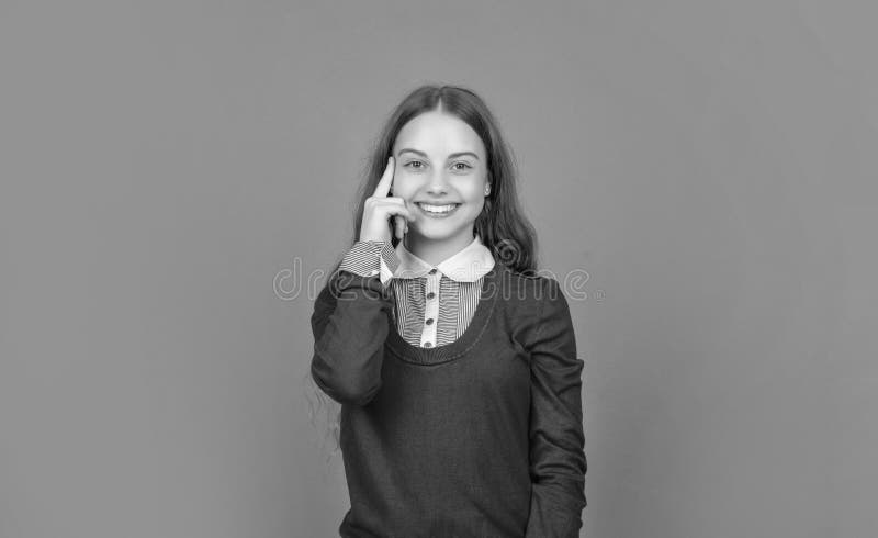 Pondering Happy Kid in School Uniform on Red Background, Student Stock ...