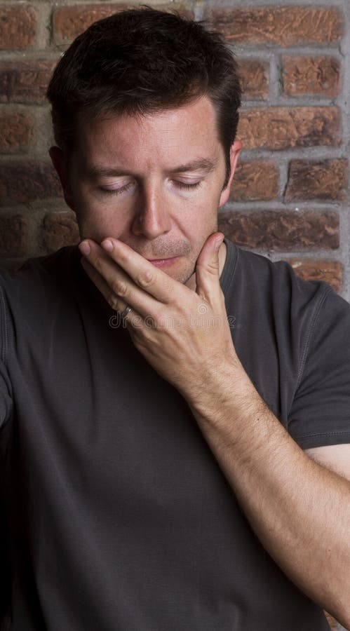 Pondering Male with Head in Hand Stock Image - Image of shirt, hold ...