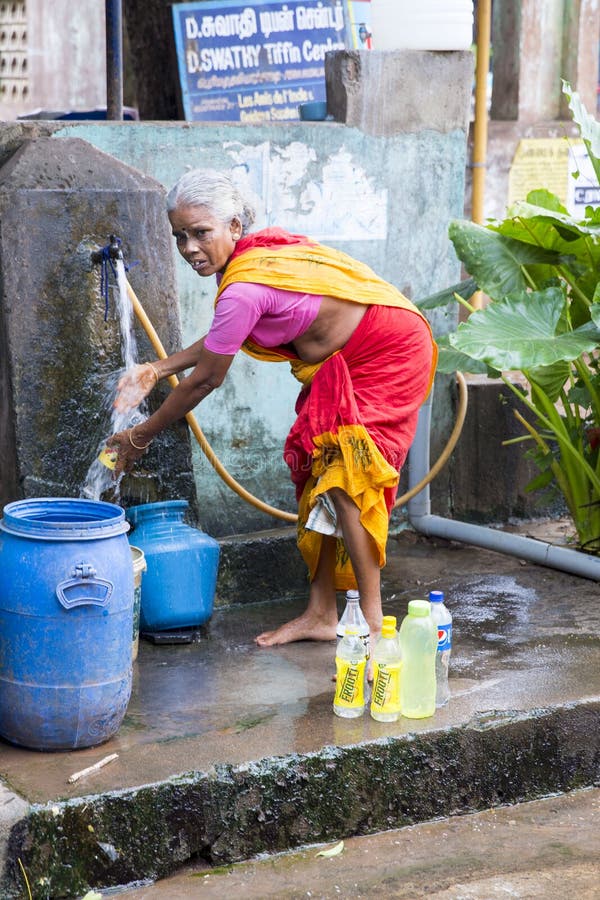 Indian Poor Woman Wash Clothes In Street Rural Village Editorial