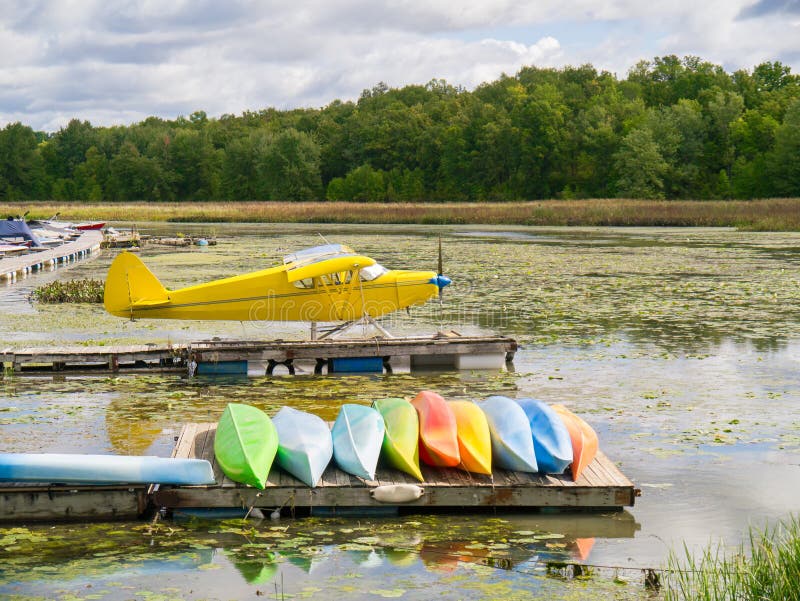 Pontoon Airplane at Dock stock image. Image of airplane - 27080579