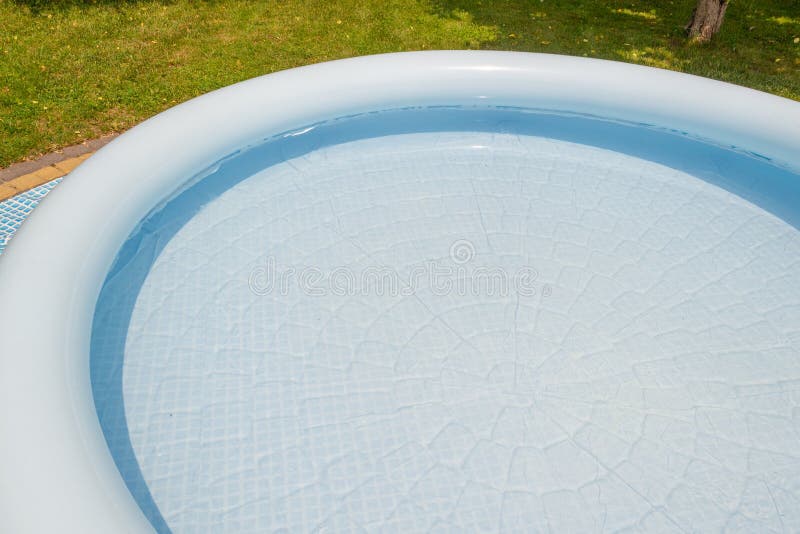 A Round, Blue, Garden Pool for Children. Stock Image - Image of ...