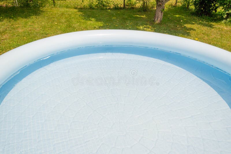 A Round, Blue, Garden Pool for Children. Stock Photo - Image of ...