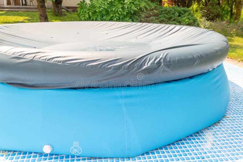 A Round, Blue, Garden Pool for Children. Stock Image - Image of small ...