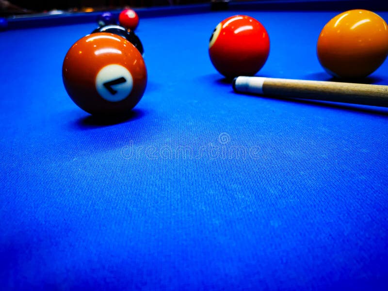 4 Pool Ball and a Pool Cue in Focus on a Blue Pool Table, Snooker Table ...