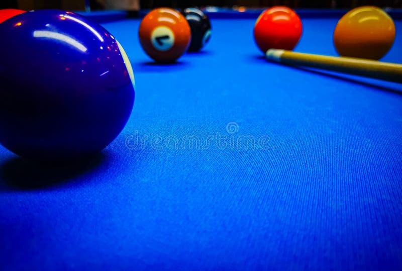 5 Pool Balls with a Pool Cue Placed on a Blue Pool Table, Snooker Table ...