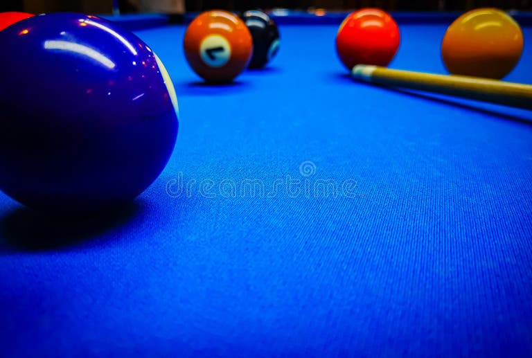 5 Pool Balls with a Pool Cue Placed on a Blue Pool Table, Snooker Table ...