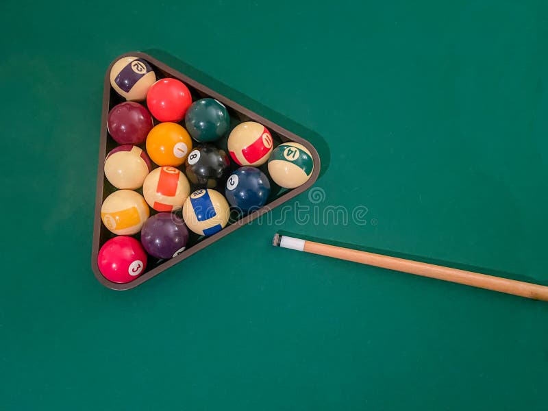 Pool Balls in Triangle and Cue on Green Pool Table Stock Image - Image ...