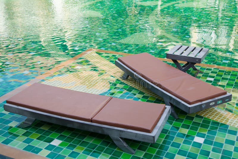 Bed beside the pool. stock photo. Image of poolside, vertical - 20332570