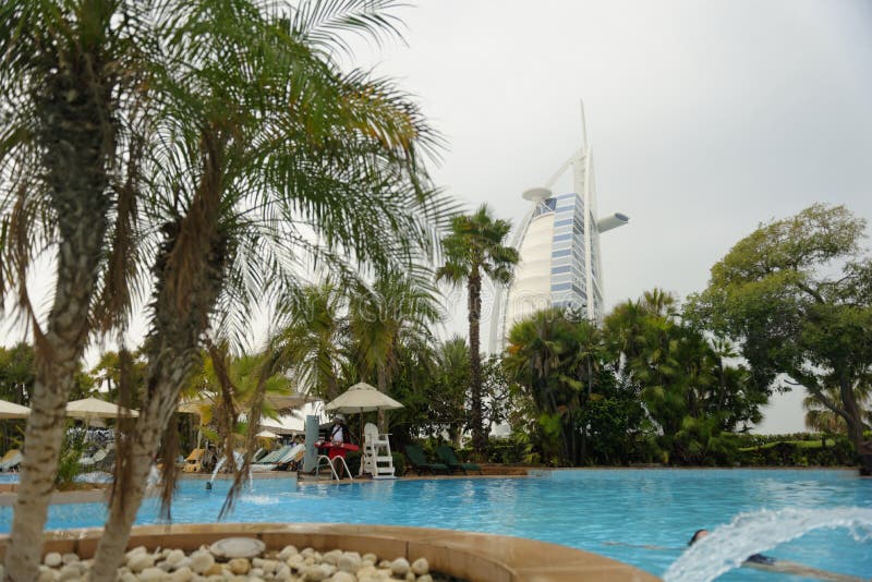Pool with Burj Al Arab in Background Editorial Photography - Image of ...