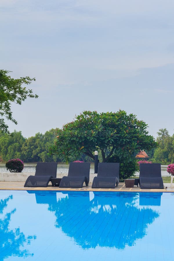 Pool chair stock photo. Image of solitude, travel, waterside - 115925850