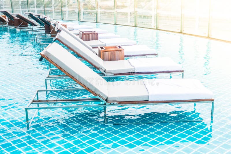 Pool chair stock image. Image of deck, hotel, resort - 75405875