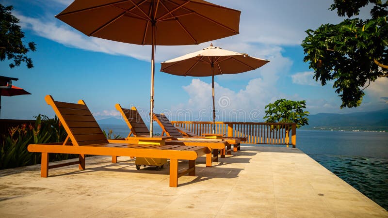 Pool Chairs with Modern Design and Beautiful View at Johana Cottage ...