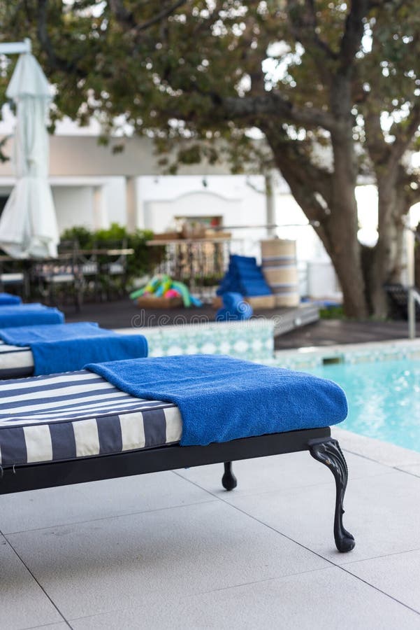 Pool chairs stock photo. Image of tourism, deck, pool - 43324862