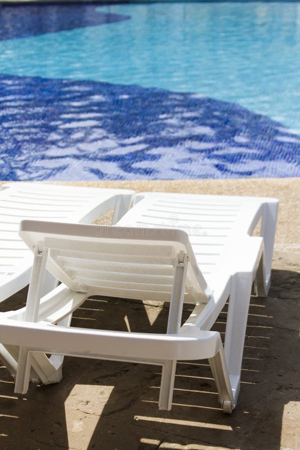 Pool chairs stock photo. Image of leisure, climate, sunlight - 30684698