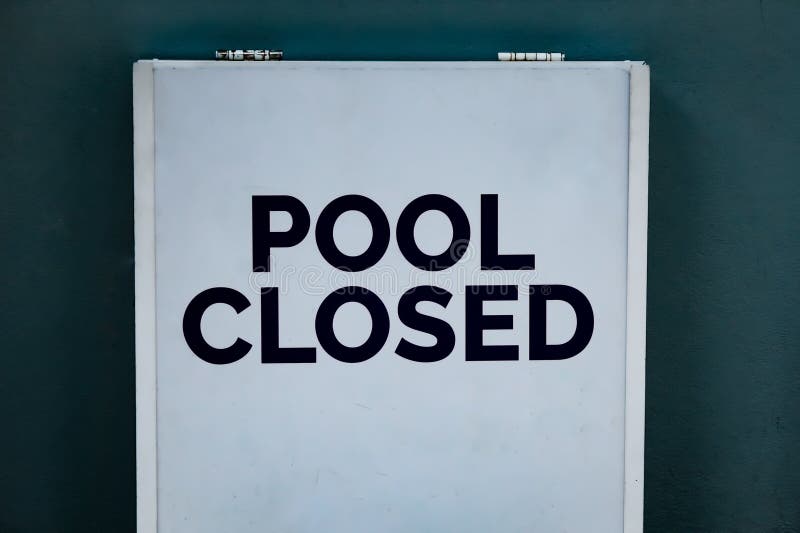 A Pool Closed Sign with Space for Copy Isolated Against a Dark Green ...