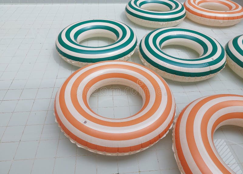 Pool Decoration Using Inflatable Floats with Striped Designs Stock ...