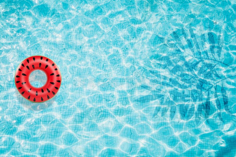 Pool Float, Ring Floating in a Refreshing Blue Swimming Pool with Palm ...