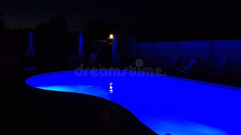 The Pool Glows Blue-purple at Night.water Illumination Stock Photo ...