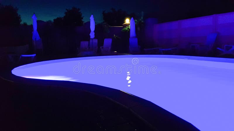 The Pool Glows Blue-purple at Night.water Illumination Stock Image ...