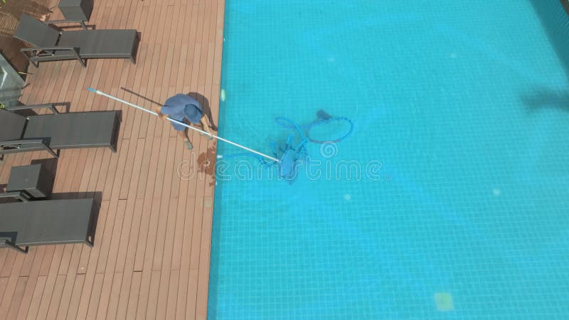 Pool Maintenance with Automatic Robot. Cleaner the Bottom of the Pool ...
