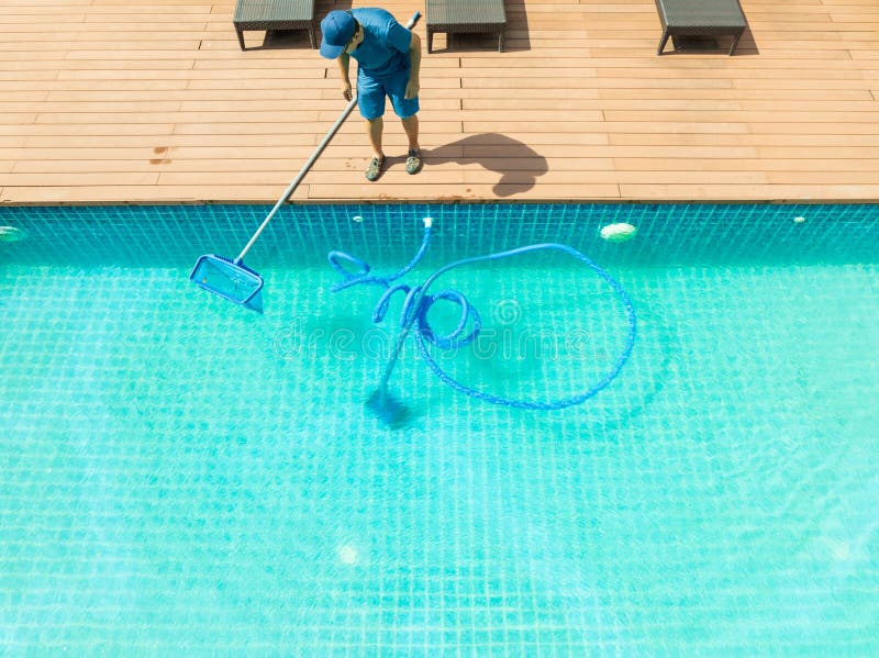 Pool Maintenance with Scoop Net and Automatic Robot Cleaner Stock Photo ...