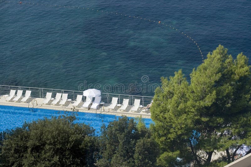 Pool near sea stock photo. Image of tourist, chairs, pool - 11592178