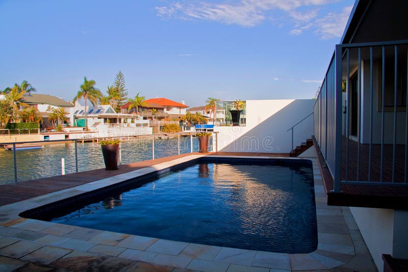 Pool Overlooking Canal stock photo. Image of waterfront - 12930360