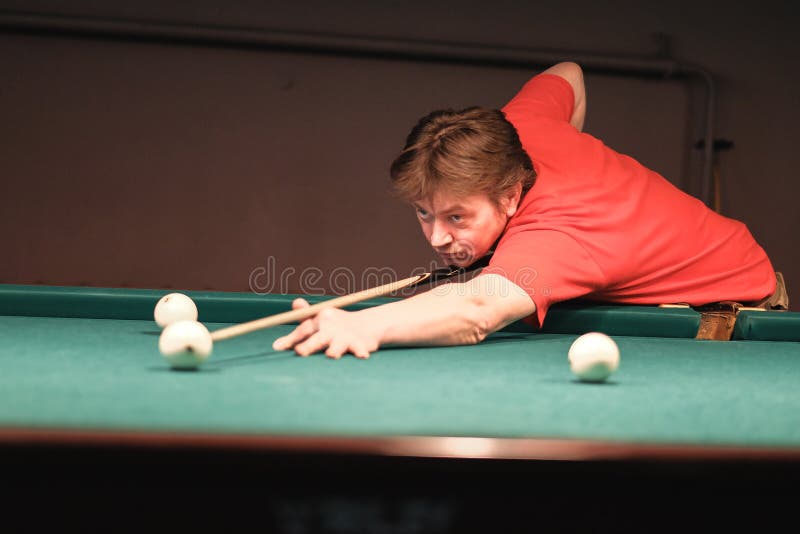 A Pool Player Takes Aim at the Ball Stock Photo - Image of lucky ...