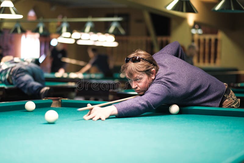 A Pool Player Takes Aim at the Ball Stock Image - Image of line ...