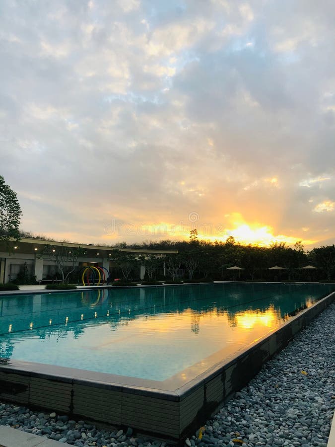 Pool Reflecting the Gorgeous Sky at Sunset with a Golden Glow and ...