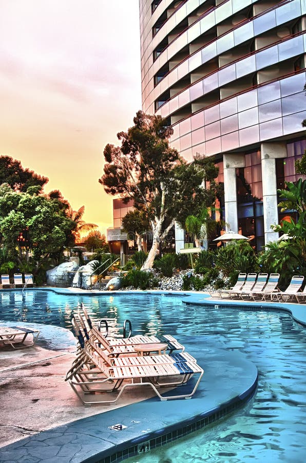 Pool and resort at Sunset stock photo. Image of furniture - 17082382