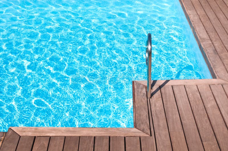 Blue Swimming Pool with Teak Wood Flooring Stock Image - Image of decor ...