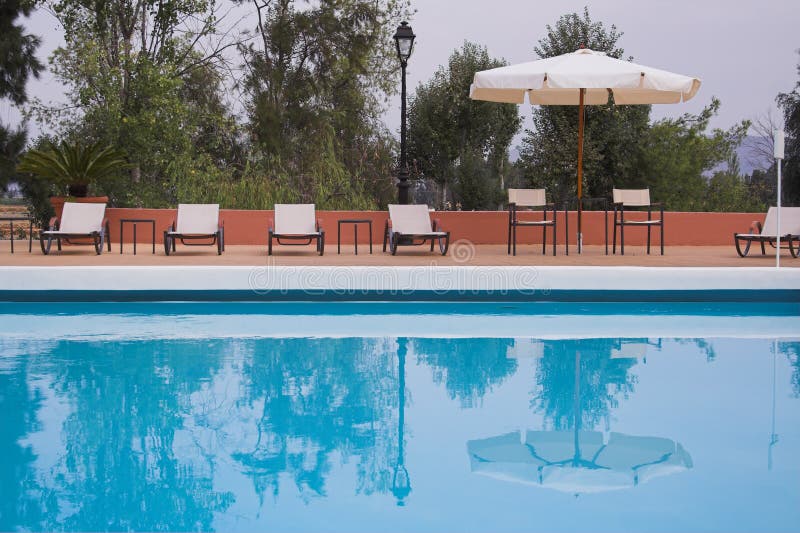 Pool-side lounge stock photo. Image of recline, tree, lounge - 1399244