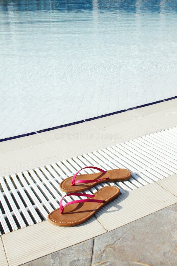 Pool and slippers stock photo. Image of colored, edge - 61177992