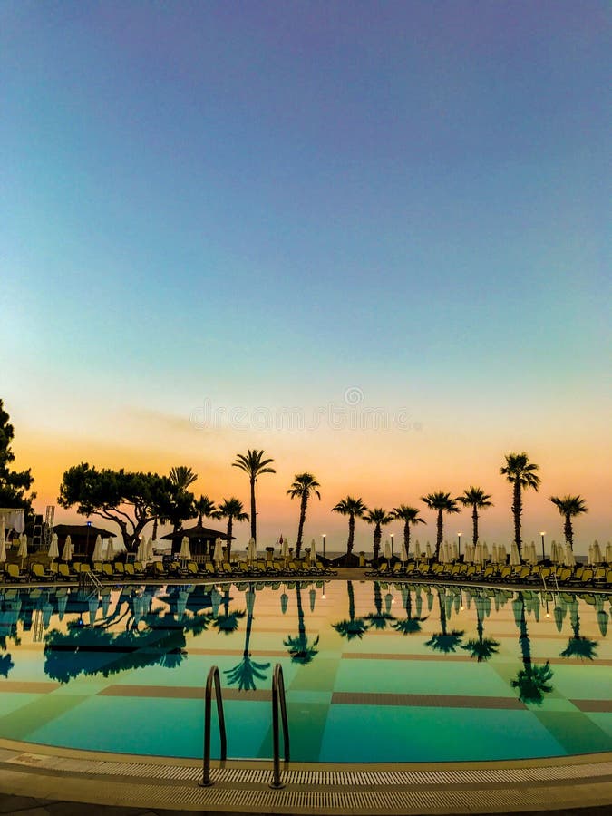 Swimming pool and sunset stock photo. Image of home, lifestyle - 13024896