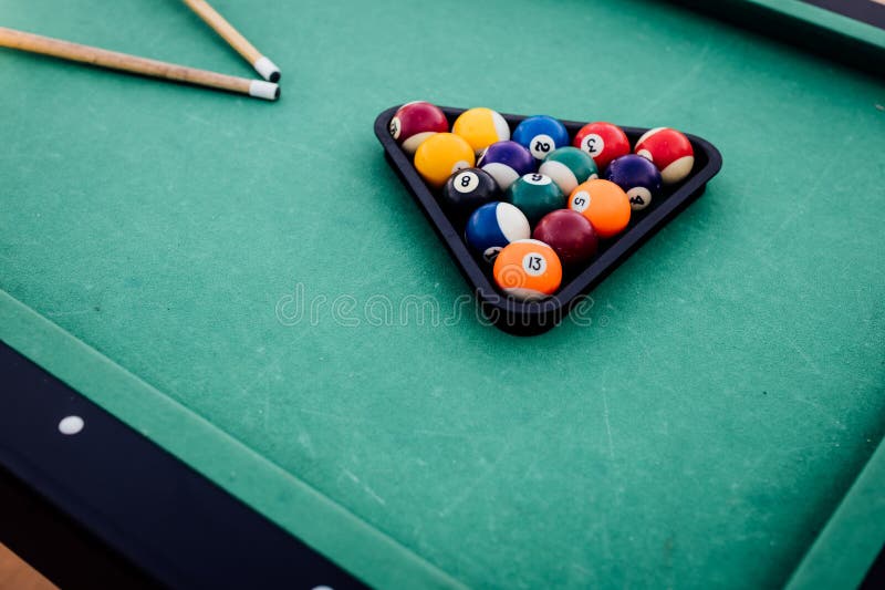 A Pool Table with Scattered Billiard Balls, a Cue Stick Stock Image ...