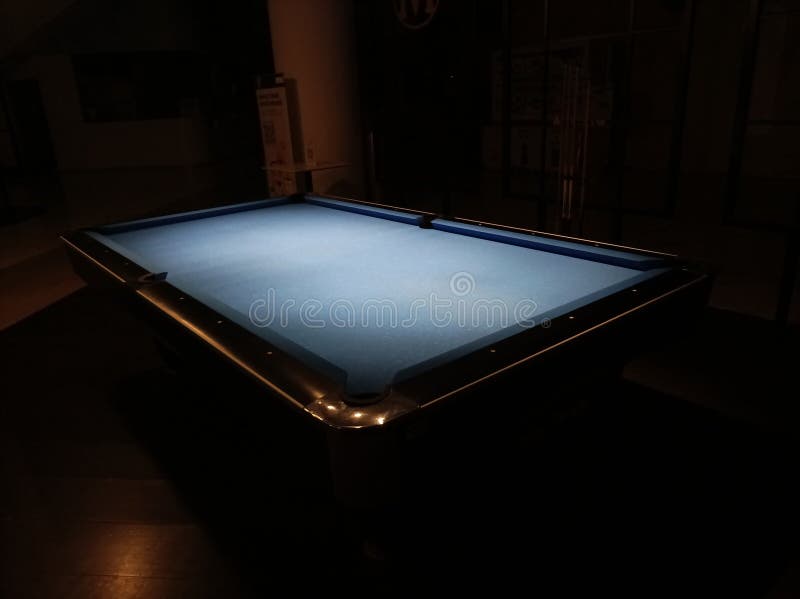 Pool Table in Hall with Lit by Lamps on a Dark Background Stock Photo ...
