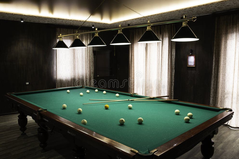 Pool Table, Lights, and an Area Rug. Stock Photo - Image of balls ...