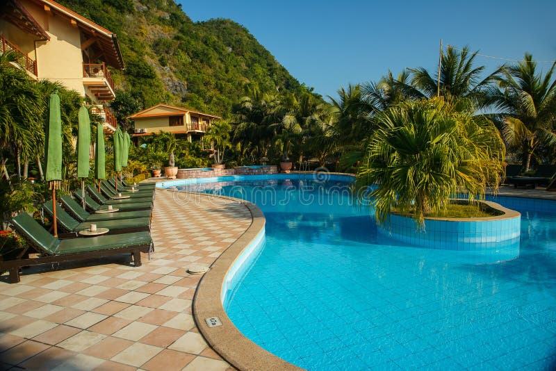 Pool in a tropical resort stock image. Image of leisure - 51986453