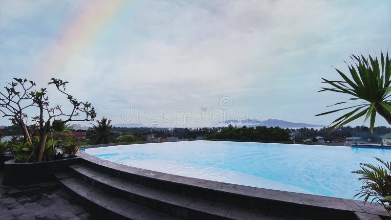 A Pool with Water is Blue a Tree in the Background Stock Photo - Image ...