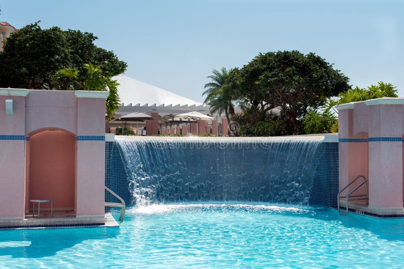 Waterfall at Resort Swimming Pool Stock Photo - Image of pool, side ...