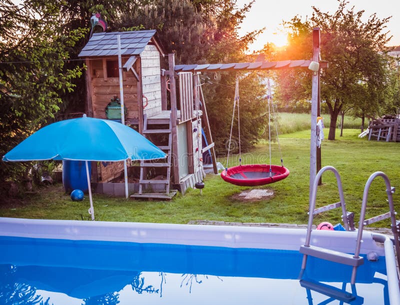 Pool in Your Own Garden with Swings and Playground Stock Image - Image ...
