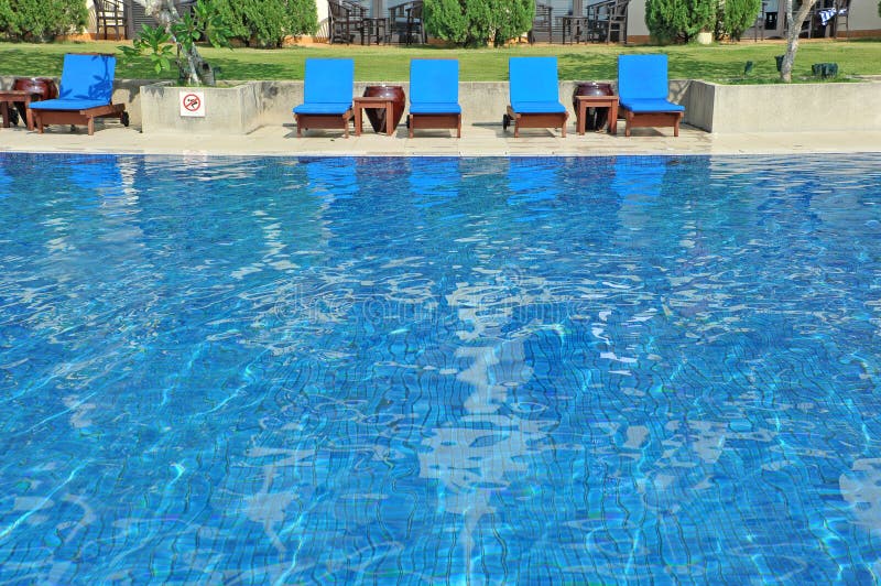 Poolside Benches stock photo. Image of colourful, resort - 20024280