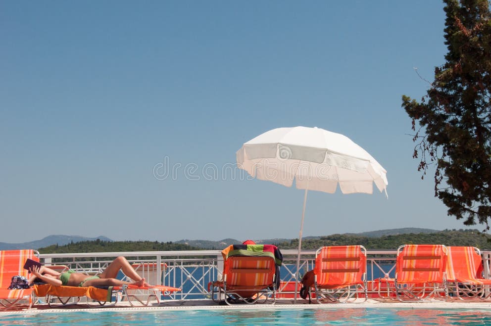 Poolside reading stock image. Image of europe, leisure - 27117837