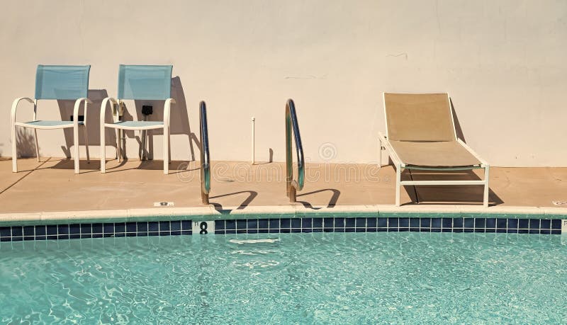 Poolside with Sunbed at Blue Pool Water in Summer Stock Photo - Image ...