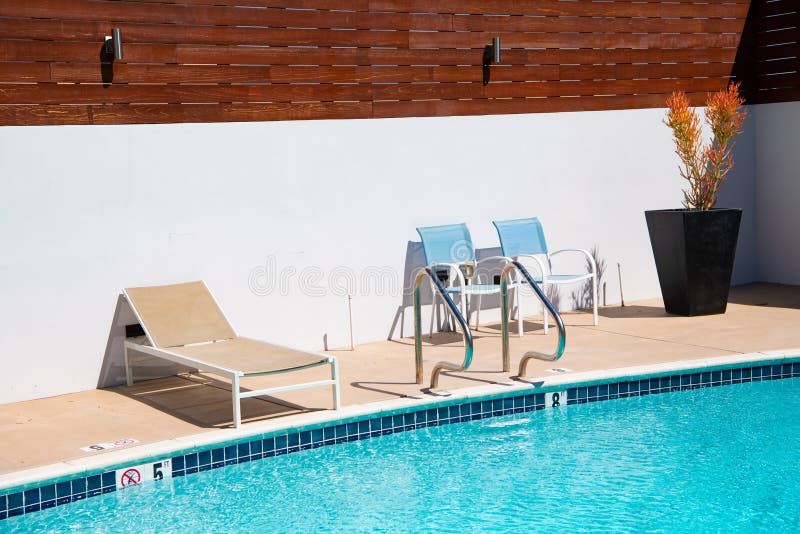 Poolside with Sunlounger and Chairs for Recreation at Outdoor Backyard ...