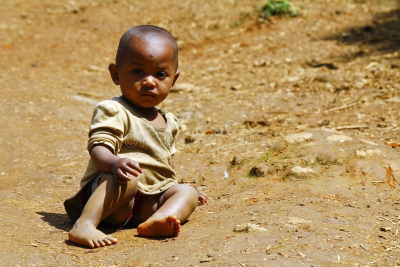 Poor African Kid on Ground, Madagascar Stock Image - Image of helpless ...