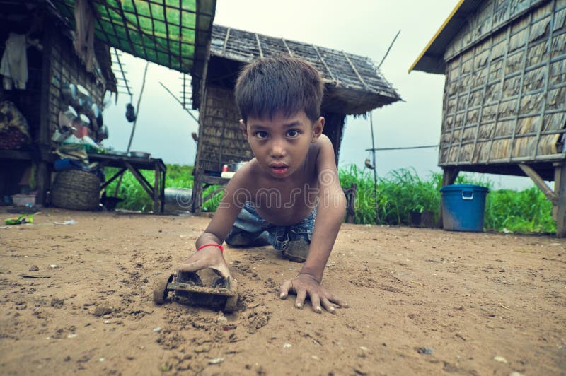 Poor cambodian kid playing editorial image. Image of bengalore - 8433685
