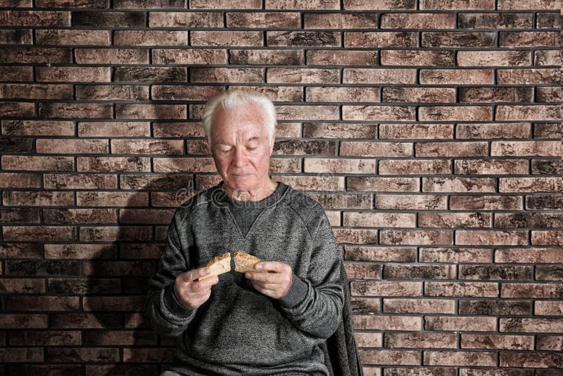 Poor Elderly Man with Bread Stock Photo - Image of food, beggary: 129845504