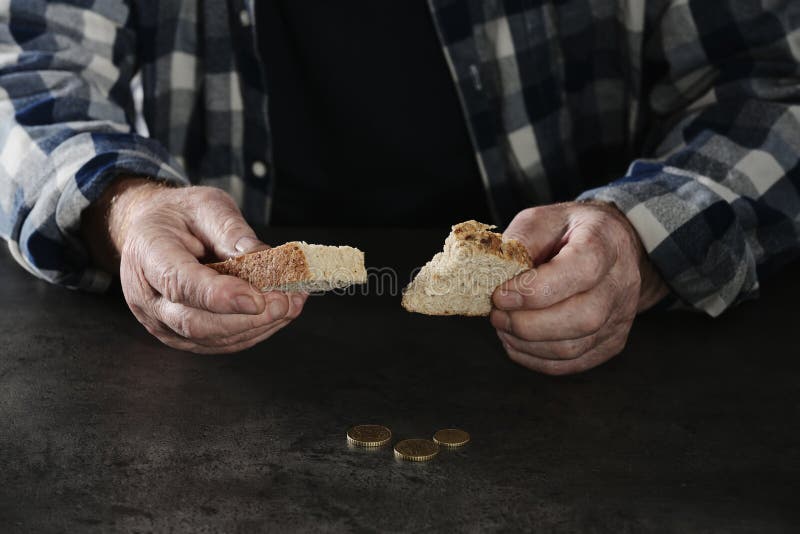 Poor Elderly Man with Bread at Table, Focus Stock Photo - Image of ...